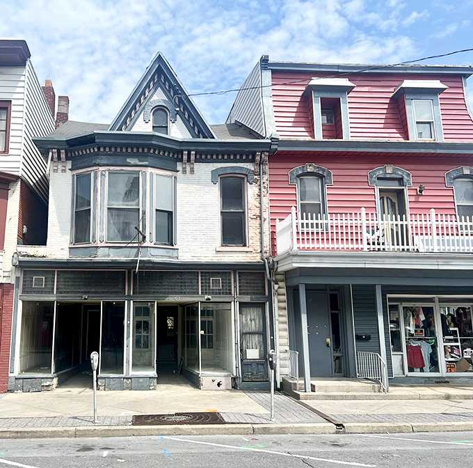 Colorful storefronts along Market Street maintain their early 20th-century character, housing locally-owned businesses that serve the community.