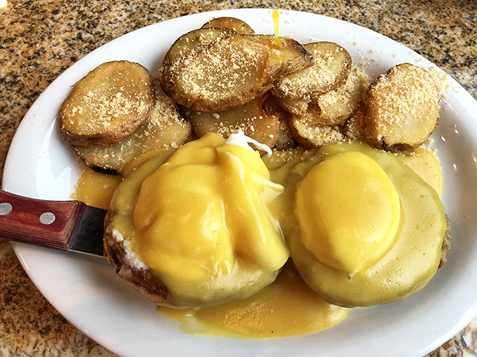 Eggs Benedict done right &ndash; golden hollandaise cascading over perfectly poached eggs like a sunrise over Newport's coastline.