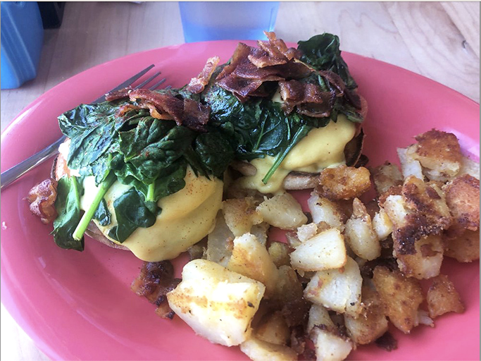 Eggs Benedict elevated with saut&eacute;ed spinach and bacon, because brunch should always feel like a special occasion.