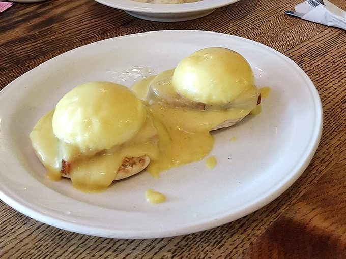Eggs Benedict done right – two perfectly poached eggs nestled on English muffins, blanketed in hollandaise that's worth getting out of bed for.