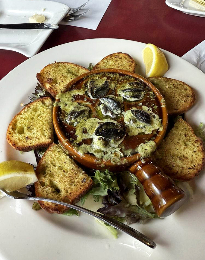 Escargot swimming in garlic butter with toast points standing by&mdash;a French classic that found a comfortable retirement home in Florida.