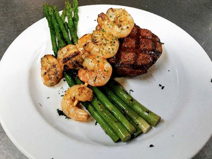 The surf and turf that launched a thousand food dreams. Perfectly grilled shrimp nestled against a steak that needed no sauce&mdash;just respect and proper cooking.
