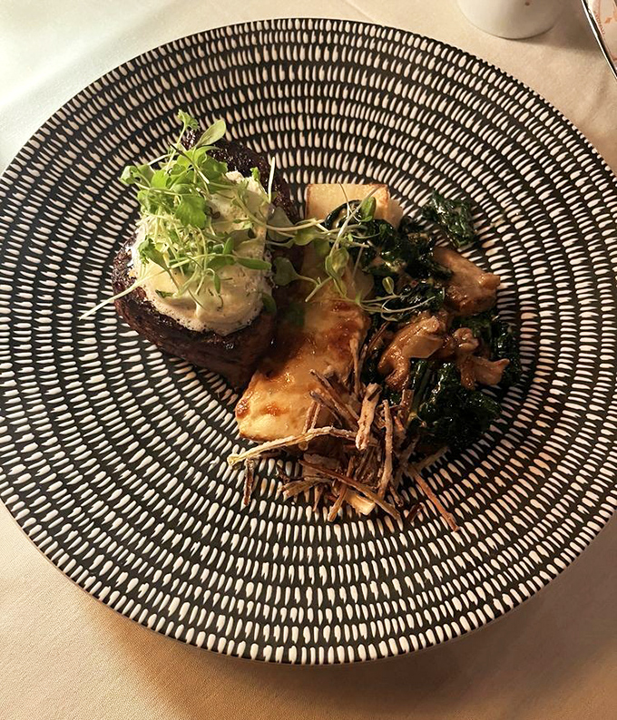 A perfectly cooked filet mignon, presented with artistic flair&mdash;proof that fine dining can be both elegant and effortlessly inviting.