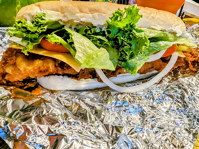 A sandwich that demands two hands and zero distractions&mdash;crispy fish, fresh veggies, and a bun that knows its supporting role.