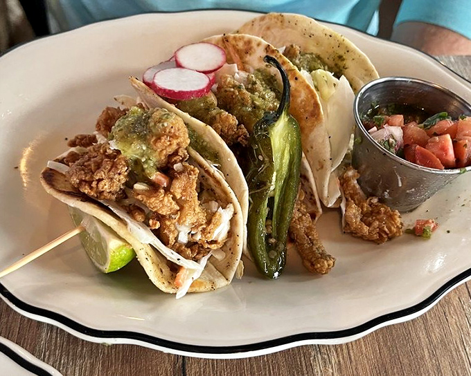 Fish tacos that make you question why you'd ever order anything else. That charred pepper is the exclamation point on a perfect sentence.