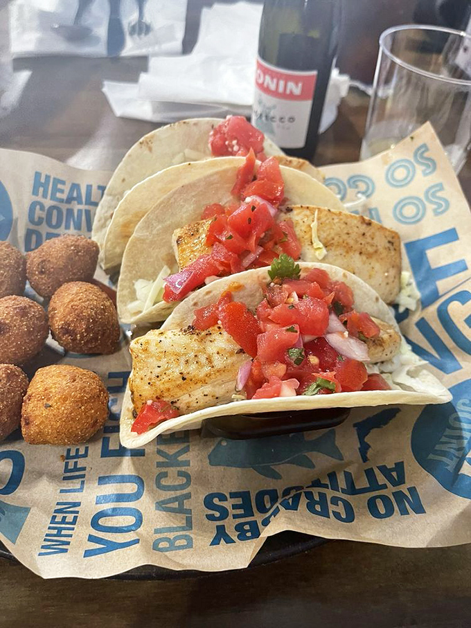 These fish tacos aren't just good, they're "tell-your-friends-and-then-lie-about-where-you-found-them" good. The hush puppies are their perfect wingmen.