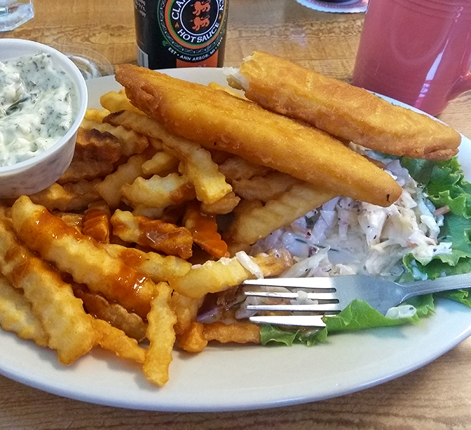 Fish and chips that would make the British proud, with a golden batter jacket protecting flaky white fish. The tartar sauce looks homemade&mdash;bonus points!