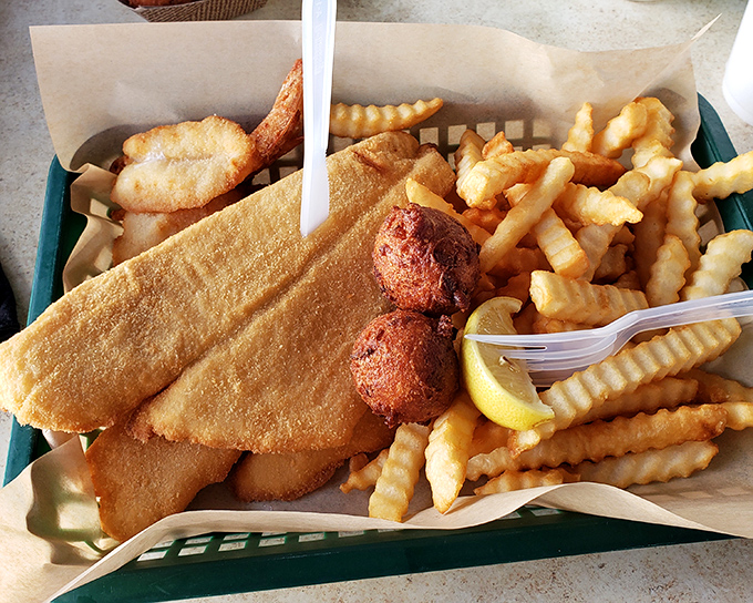 The perfect marriage of land and sea. Golden fish fillets and crispy shrimp nestled alongside hush puppies&mdash;Florida's culinary love letter.