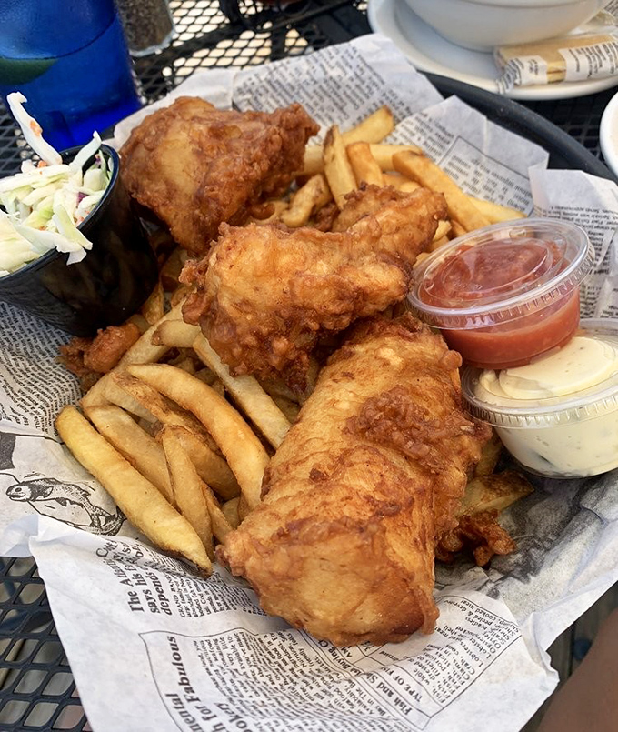 Fish and chips served on newspaper – a delicious reminder that sometimes the classics need no improvement, just fresh ingredients and proper execution.