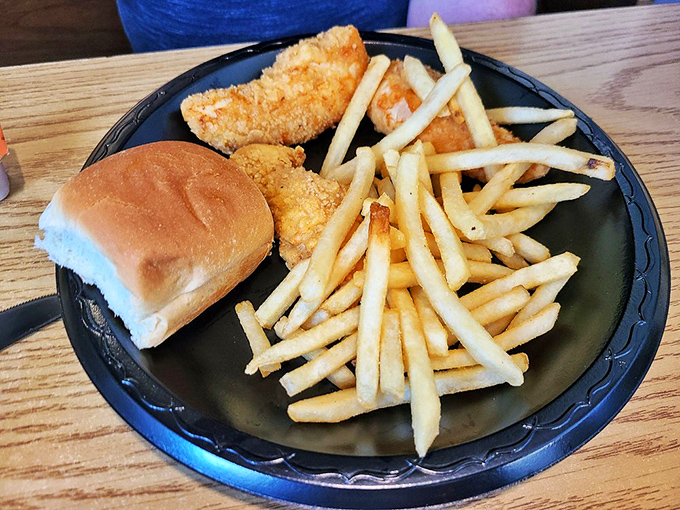 Even the non-chicken options demand respect. These golden fries and perfectly breaded fish prove the kitchen knows its way around the fryer. 