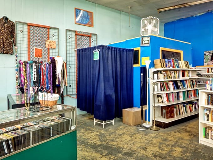 A fitting room awaits between jewelry displays and bookshelves, because trying before buying is still good policy, even when that blazer costs less than lunch. 