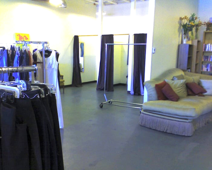 The fitting room area offers both privacy and a comfy chaise—because trying on your potential treasures deserves a touch of luxury.