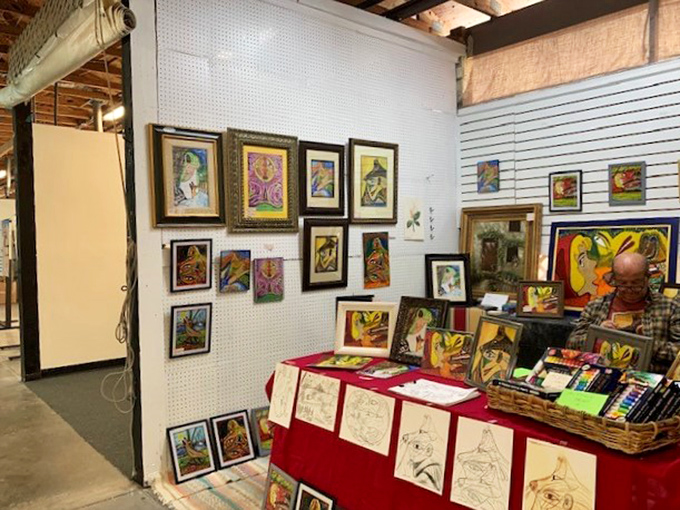 An artist's corner bursting with vibrant colors and creativity. Each frame holds a piece of someone's imagination&mdash;and possibly the perfect accent for your living room wall.