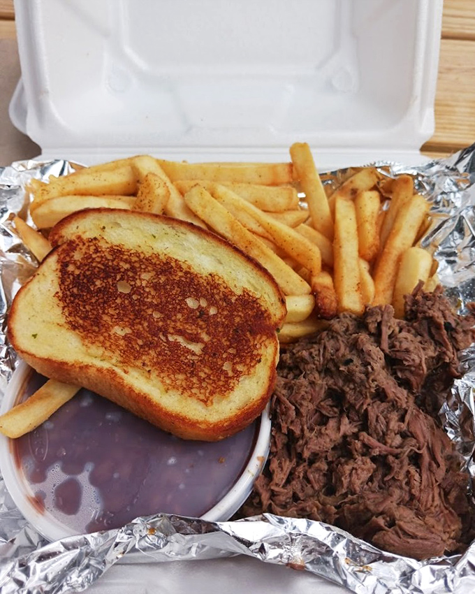 Comfort food trifecta: perfectly pulled meat, golden fries, and Texas toast. Add barbecue sauce and you've got a meal worth crossing county lines for.