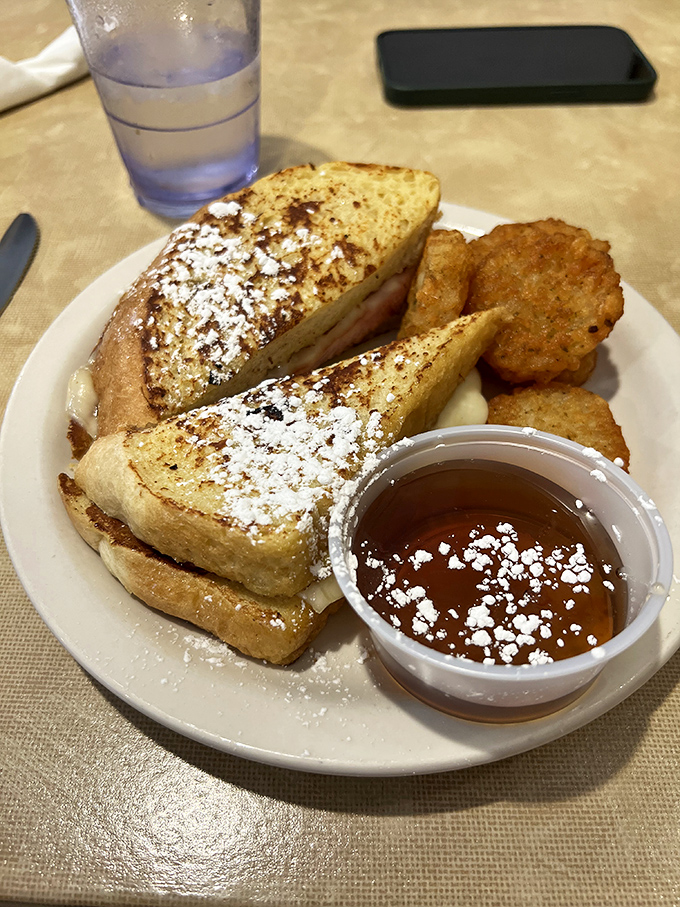 French toast that transforms ordinary bread into extraordinary breakfast magic, dusted with powdered sugar like fresh snow on a Cincinnati morning.