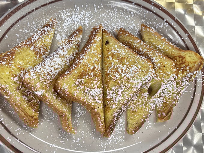 French toast dusted with powdered sugar like the first snow of winter. Simple pleasures that remind you why breakfast is the superior meal.