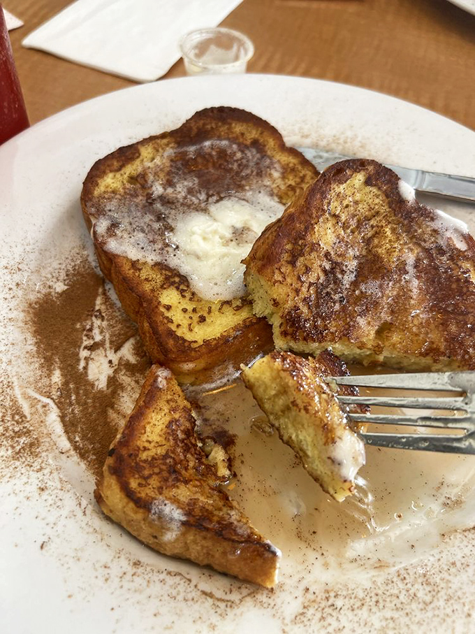 French toast that's having an identity crisis as dessert. The cinnamon-dusted masterpiece that makes waking up worthwhile.