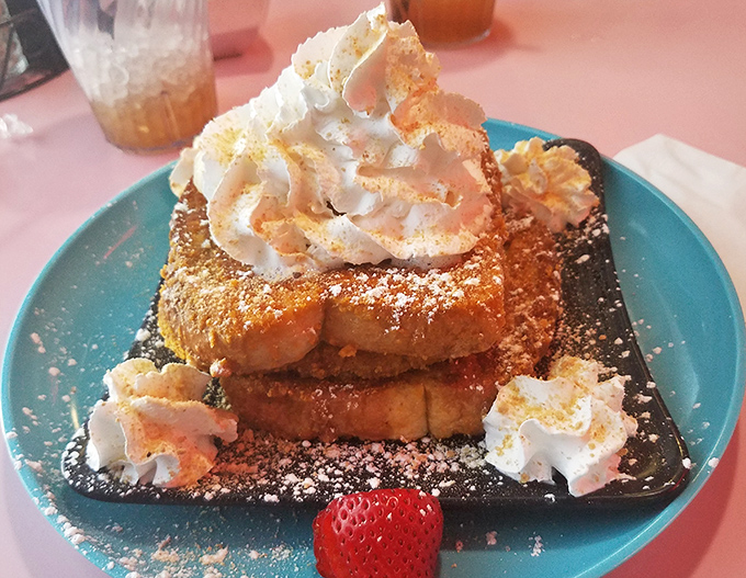 French toast that's dressed for success with clouds of whipped cream and a dusting of powdered sugar. Breakfast or dessert? Yes.