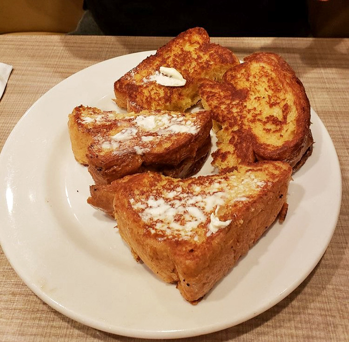French toast so golden and buttery, it makes you wonder if bread's ultimate destiny was always to be dipped, griddled, and showered with powdered sugar. 