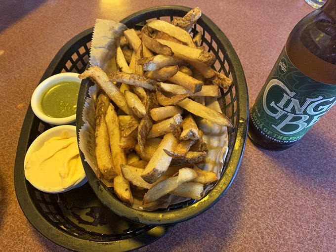 Golden fries arrive with mysterious dipping sauces, turning simple spuds into an adventure worth taking.