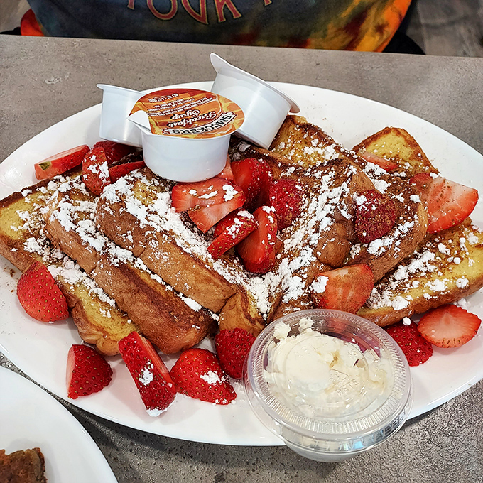French toast that's dressed for success with powdered sugar snow and fresh strawberries&mdash;breakfast that thinks it's dessert, and we're not complaining.