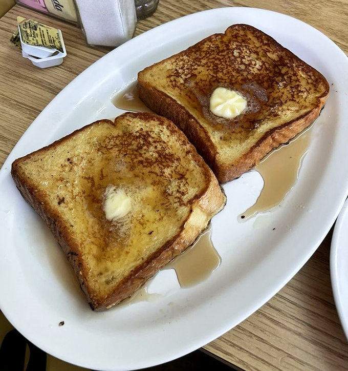 French toast thick enough to use as a doorstop, golden and buttery like edible sunshine.