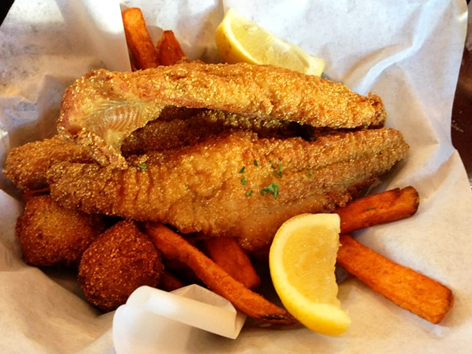 Golden-fried catfish that crackles with each bite, served with sweet potato fries that could make you forget regular potatoes exist.