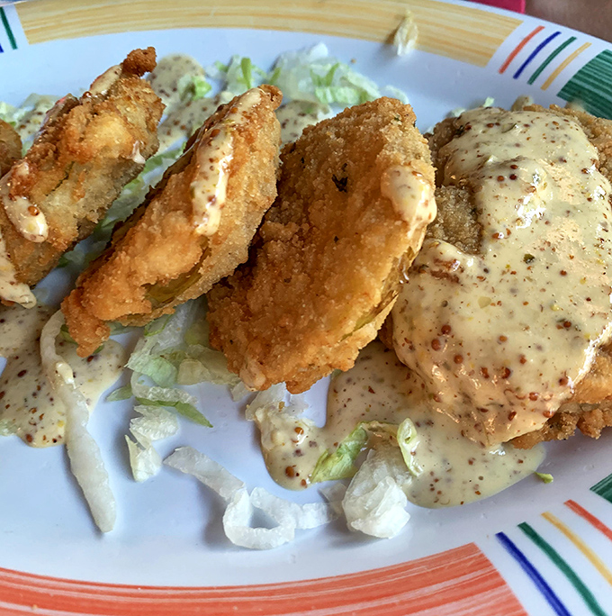 Crispy fried delights drizzled with a sauce that would make even the most sophisticated foodie lick their plate when nobody's looking.