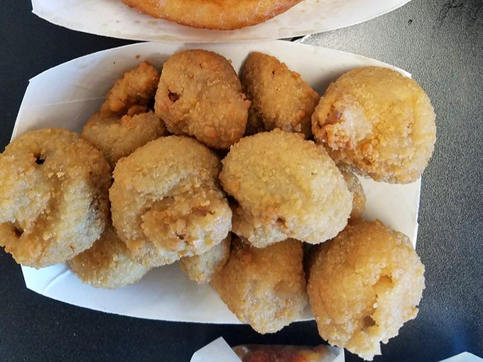 These golden-fried mushrooms aren't trying to be healthy vegetables—they've embraced their destiny as perfect bite-sized flavor bombs.