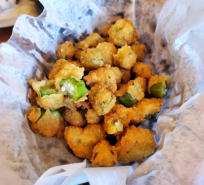 Fried okra: the unsung hero of Southern sides. These golden nuggets offer the perfect crispy-tender balance that keeps forks returning for "just one more."