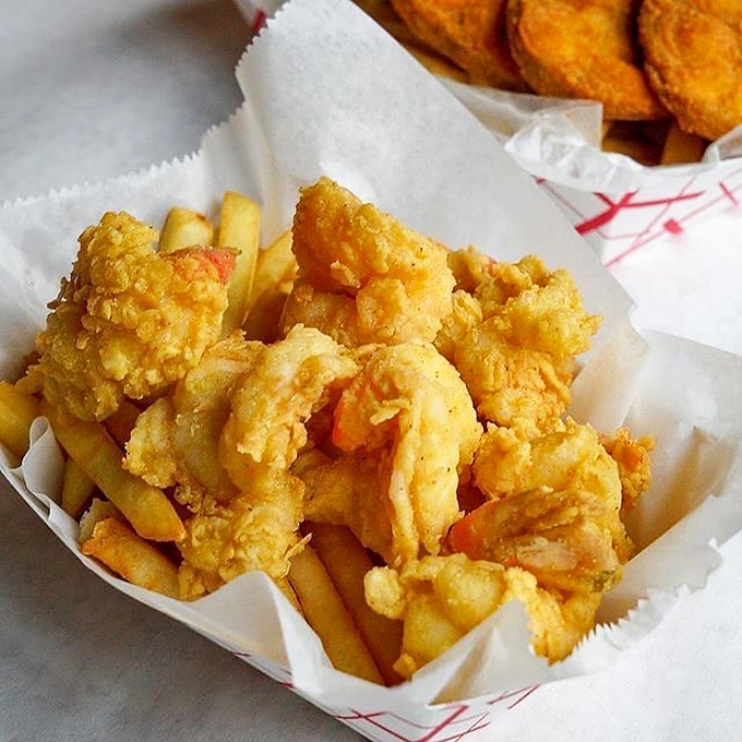 These fried shrimp aren't playing games. Golden-battered and perched atop crispy fries, they're the MVPs of the seafood basket league.