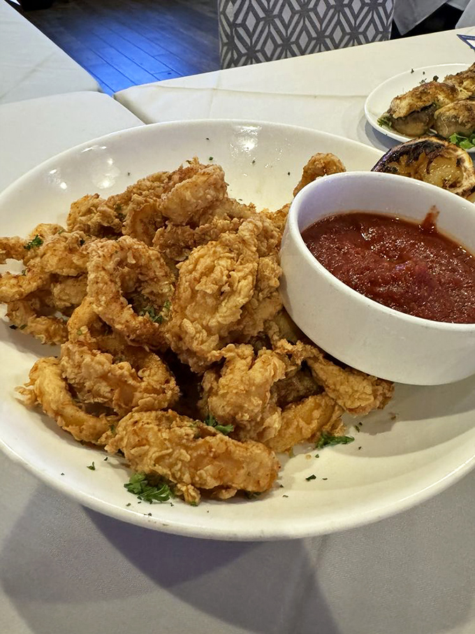 Crispy calamari that doesn't need a passport to transport you to Mediterranean bliss. The marinara sauce is practically begging for a dip.