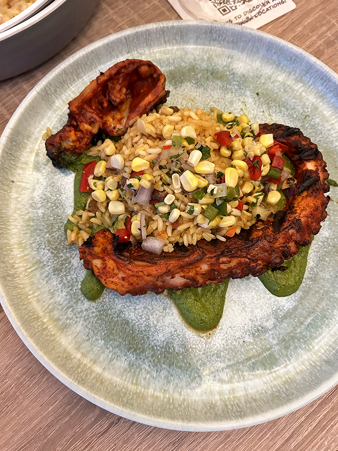 Blackened fish gets the royal treatment with corn salsa. The plate says "fine dining" but the vibe says "kick off your flip-flops."