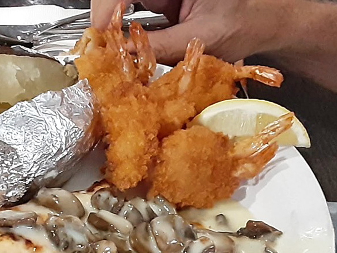 Fried shrimp that crunch like nature's potato chips from the sea. These golden-battered beauties make a compelling case for ordering seafood at a steakhouse.