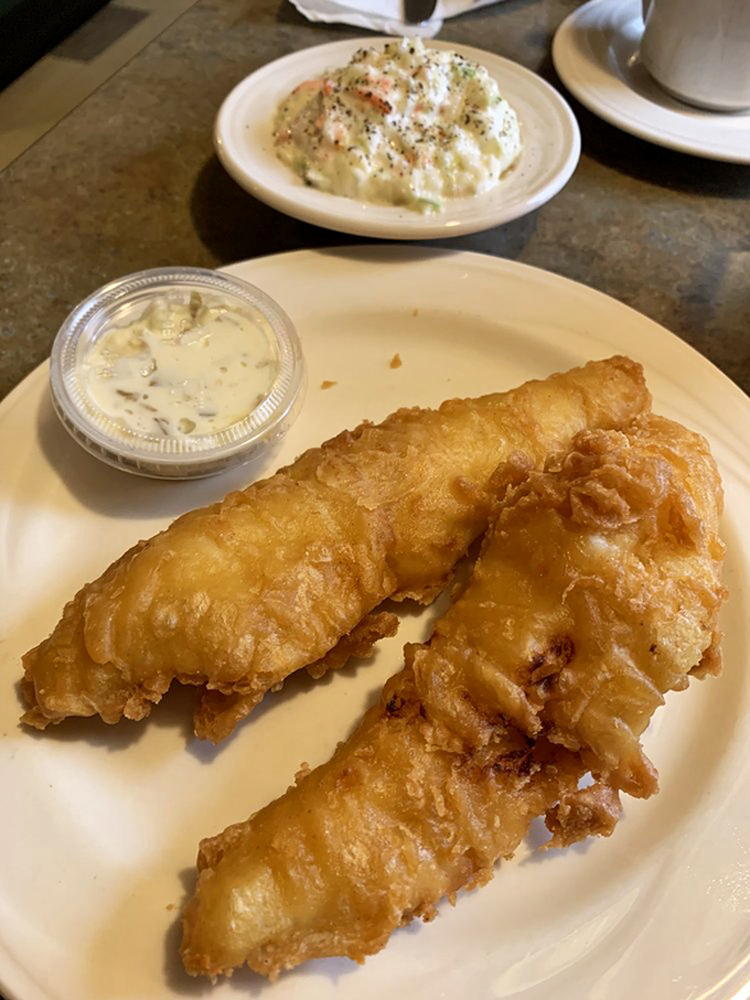 Fried walleye so perfectly golden, it makes other fish sandwiches look like they're not even trying. That tartar sauce? Pure Midwest magic.