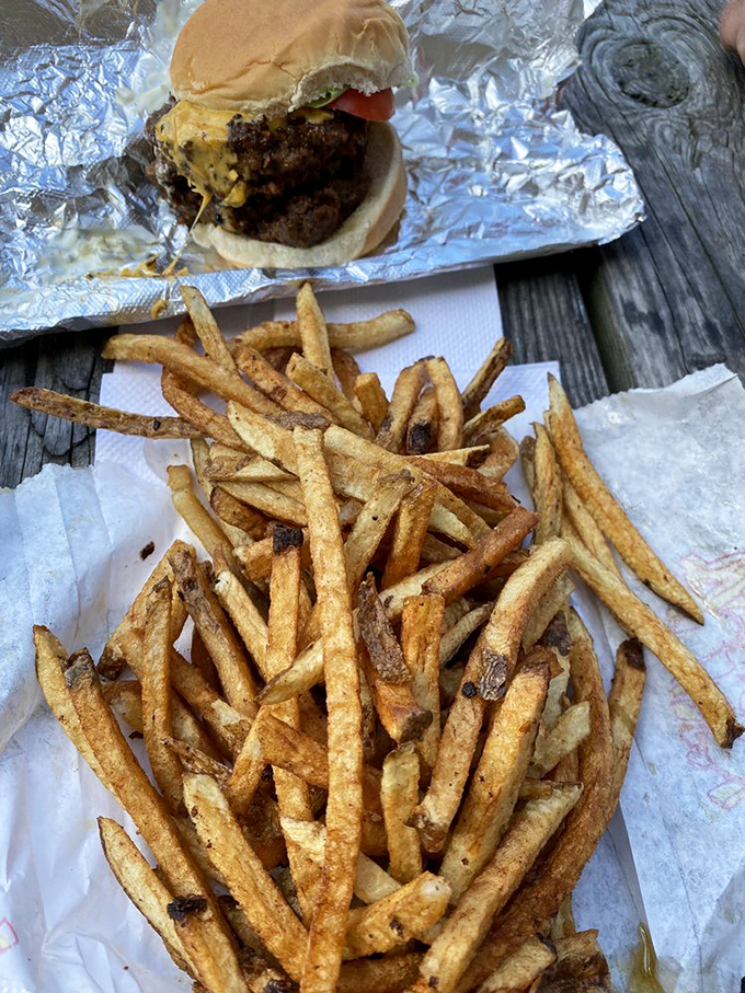 Hand-cut fries with personality and purpose. These aren't anonymous potato sticks; they're the supporting actors that sometimes steal the show.