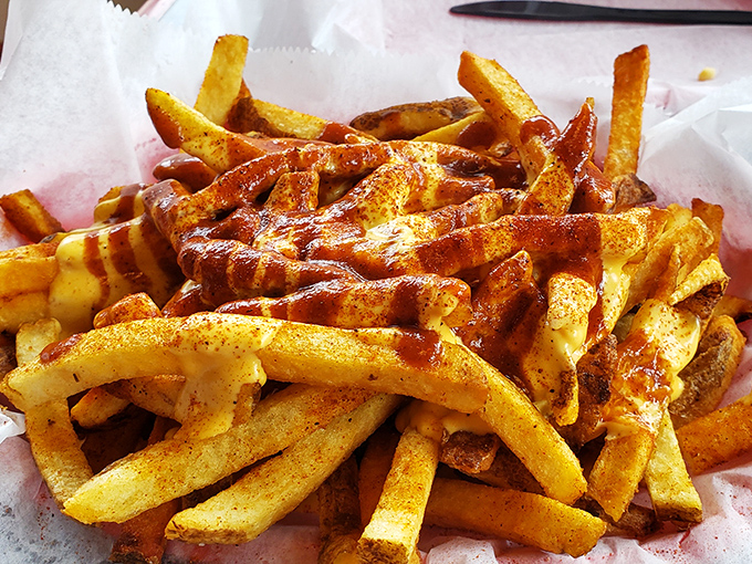 These aren't just fries&mdash;they're golden vehicles for that house seasoning, designed to make you forget your table manners entirely.