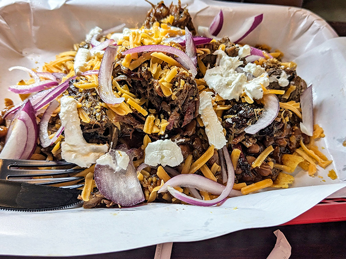 Pulled meat crowned with cheese and red onions&mdash;proof that sometimes the most satisfying relationships are the messiest ones.