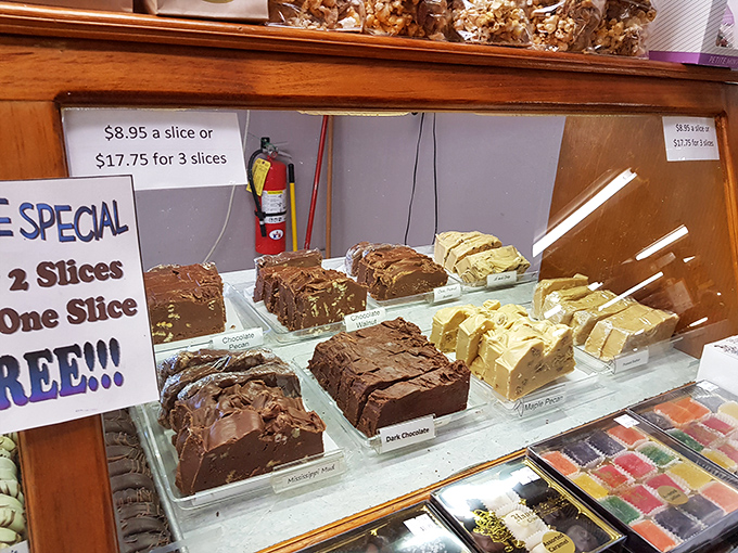 The fudge counter—where time stands still and diet plans go to die. Each slab looks dense enough to have its own gravitational pull.