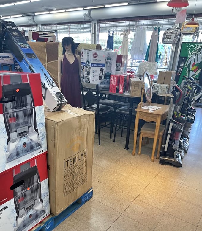 The furniture section resembles a living room time capsule, complete with mannequin observer silently judging your vacuum cleaner selection.