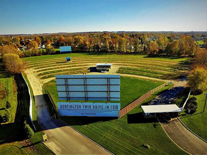 The Huntington Twin Drive-In stands as a monument to simpler times, when date night meant adjusting tinny speakers and pretending to watch the movie.