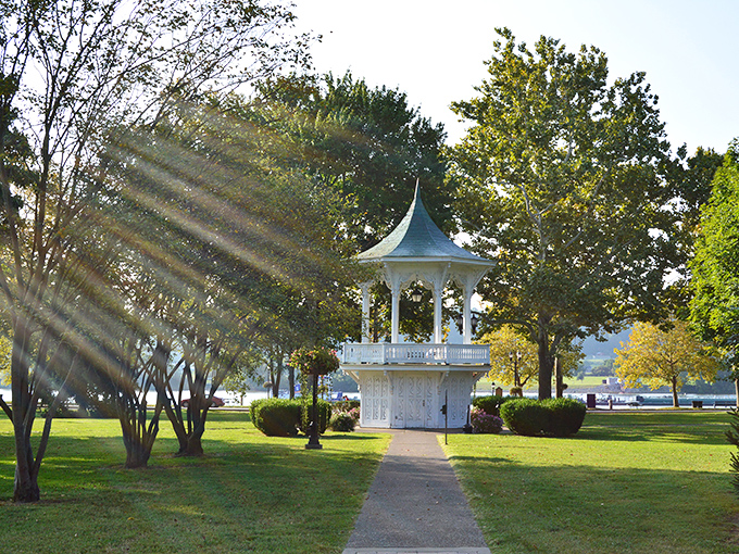 The bandstand in Gallipolis City Park catches golden sunlight, a perfect spot for free summer concerts and community gatherings.