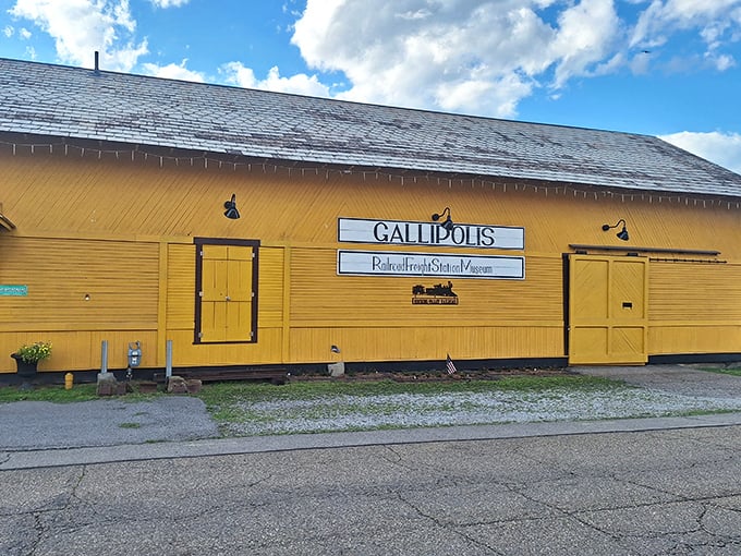The bright yellow Gallipolis Railway Freight Station Museum preserves transportation history with more charm than your average airport terminal.
