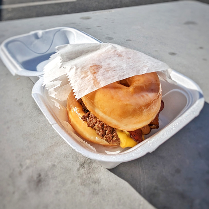 The glazed donut burger: where breakfast and lunch stop fighting and fall madly in love. Sweet meets savory in holy matrimony. 