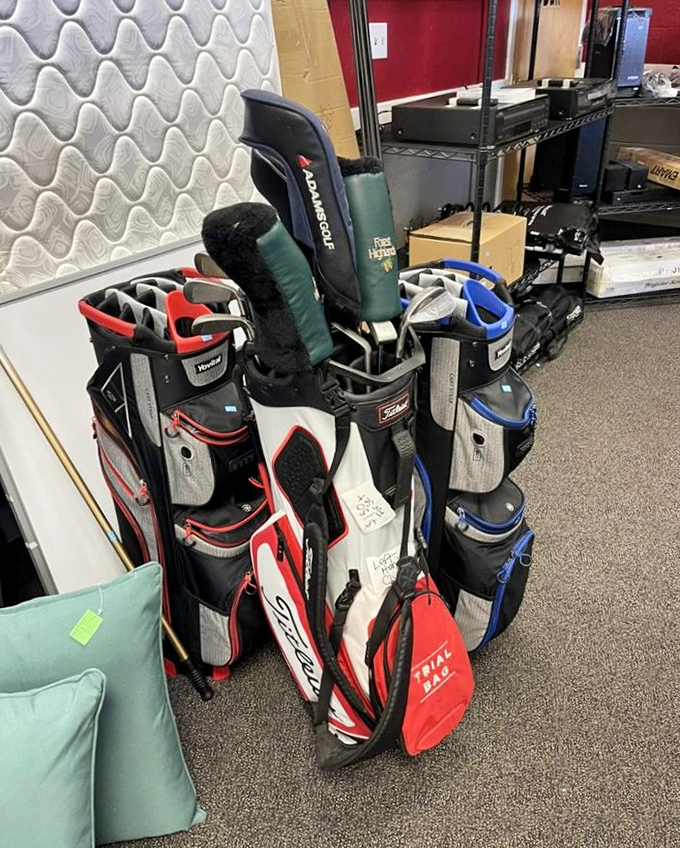Golf clubs waiting patiently for their next chance to witness spectacular sand trap adventures.