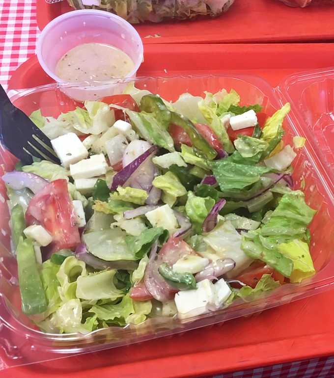 Even the salad looks like it's having more fun here—crisp, colorful, and ready to play the perfect supporting role to your pizza.