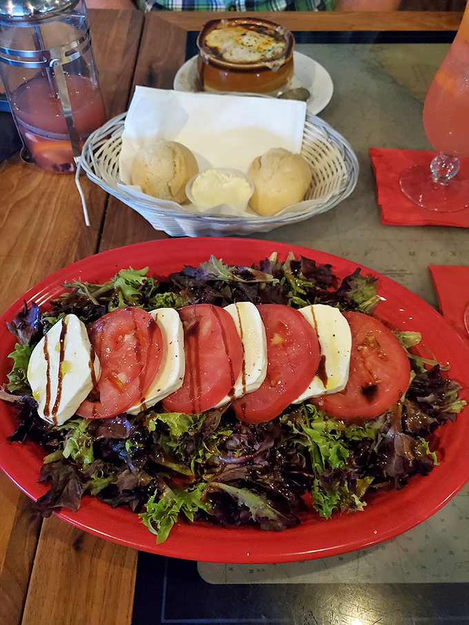 The Caprese salad that launched a thousand sighs. Those tomatoes and mozzarella slices are having the romance we all deserve.