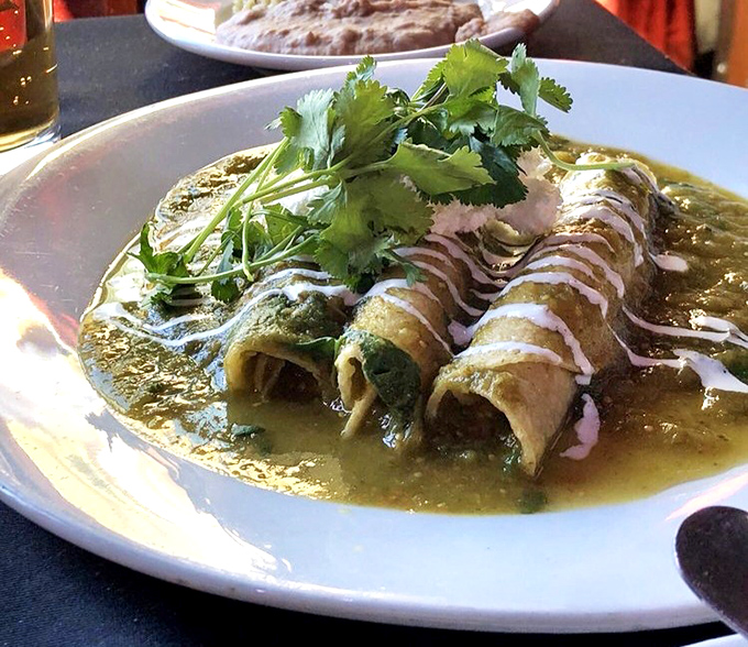 These green enchiladas swim in a sauce so vibrant it makes you wonder if other green foods have just been phoning it in.