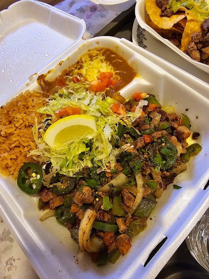 A fiesta in a takeout container. The green chile beef comes with all the fixings and a side of pure joy.
