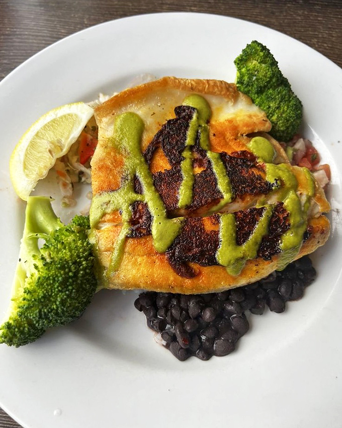 Blackened fish gets the royal treatment with a vibrant green sauce that pops both visually and on your palate. California cuisine at its finest.